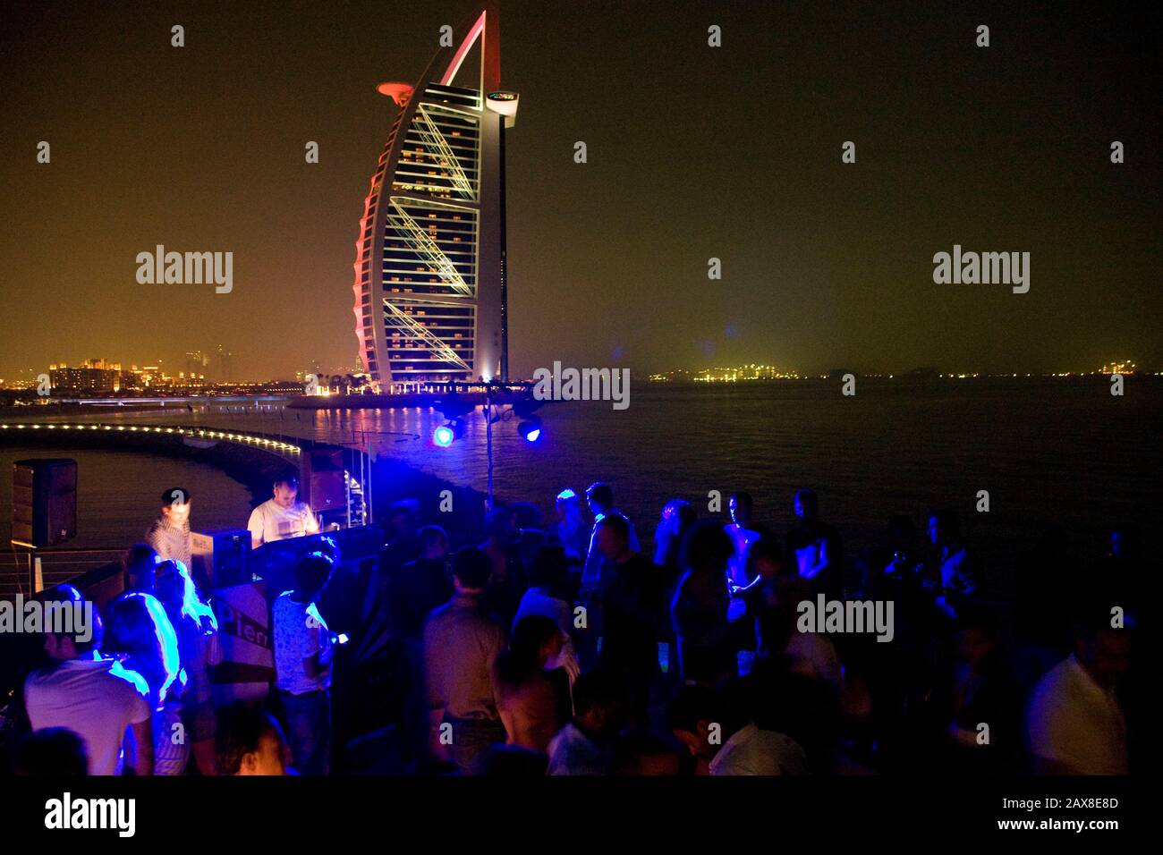 The crowd dances while the dj mixes his music at the 360 bar at the ...