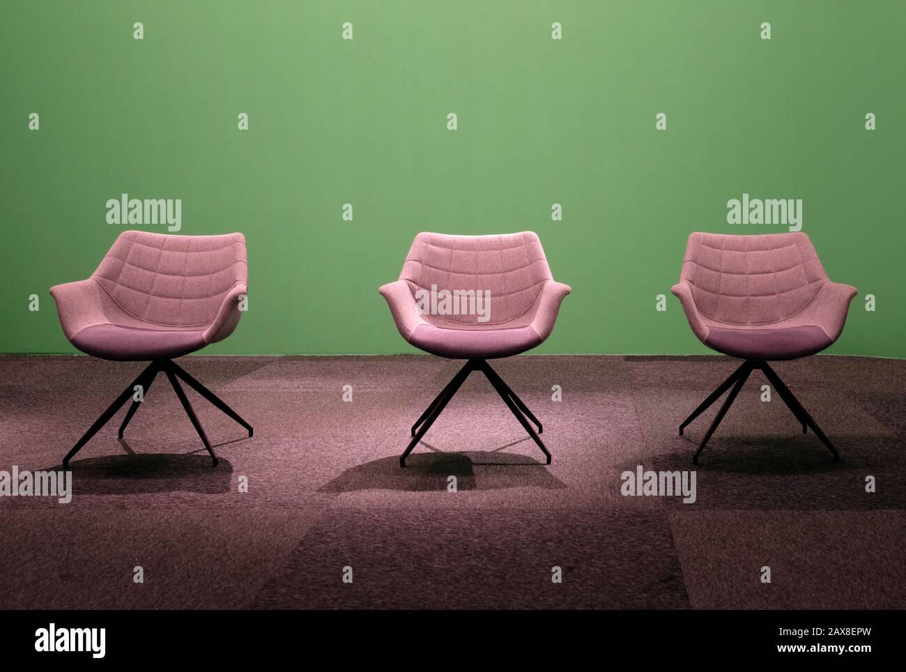 Three empty chairs in a studio with green screen Stock Photo - Alamy