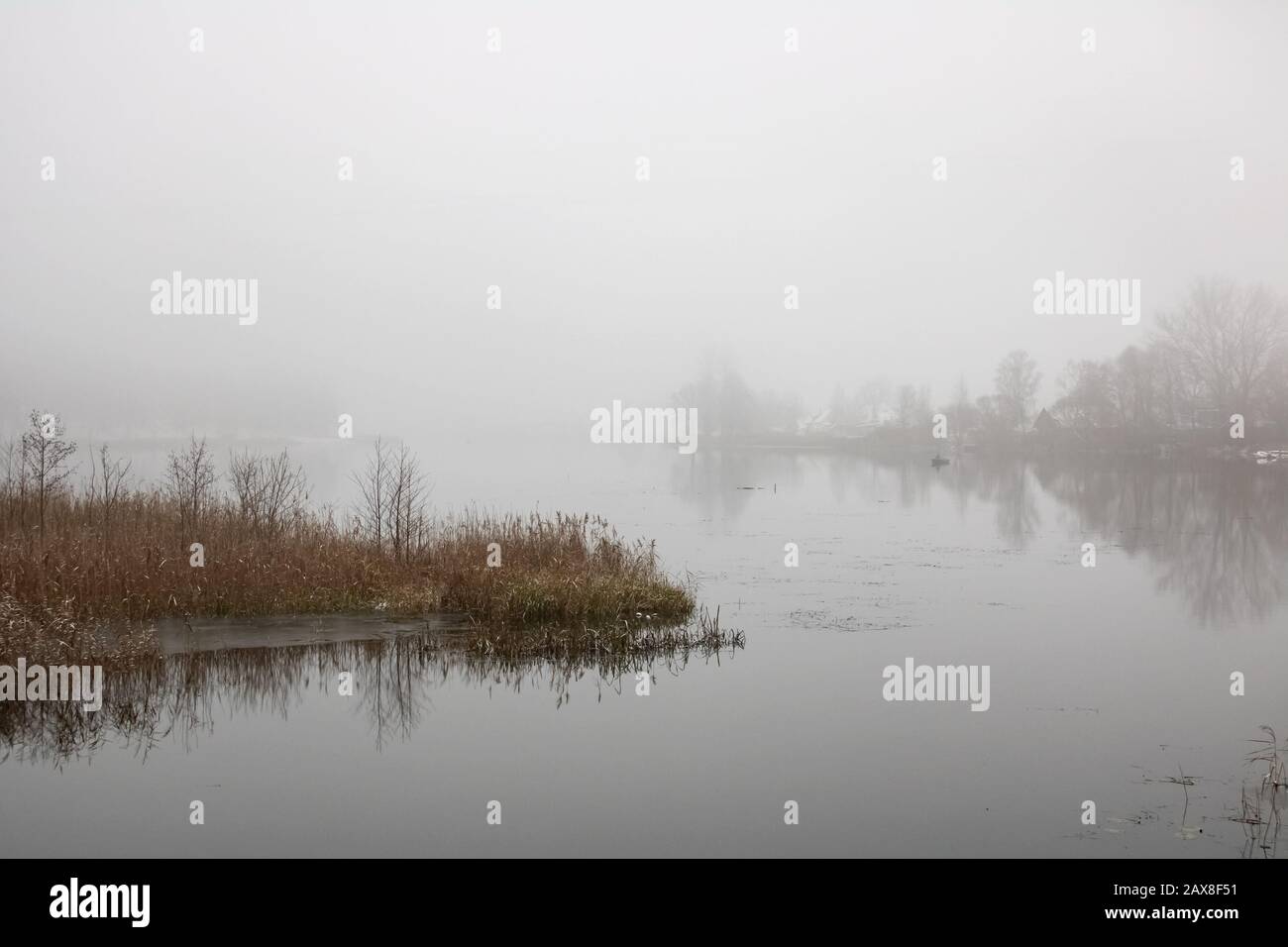 Thick fog over the river and a boat Stock Photo - Alamy