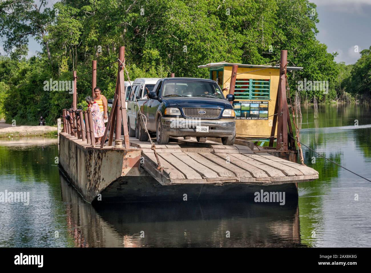 Hand-cranked cable ferry crossing New River from Corozal Town to Copper ...