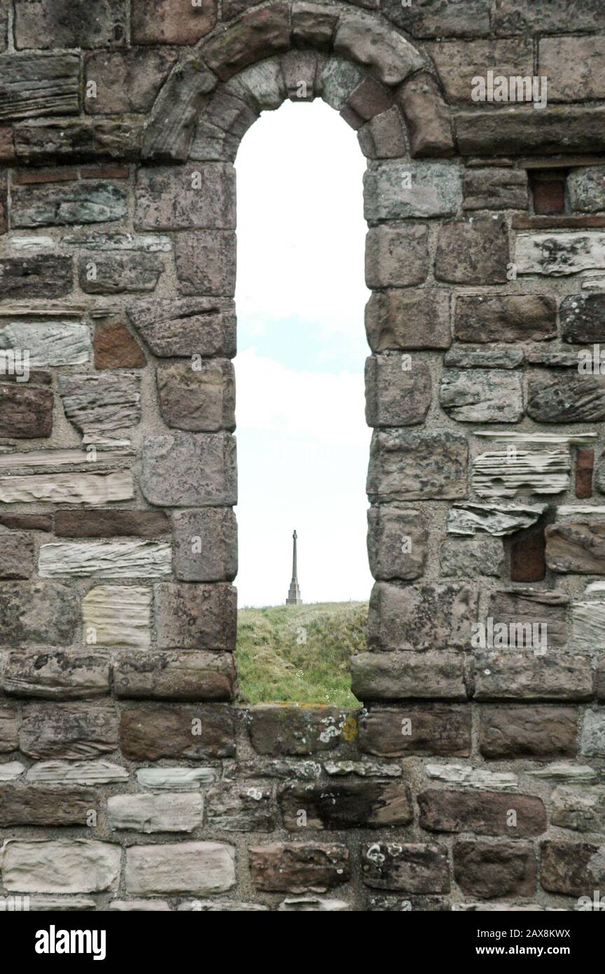 Architectural detail of stone arch in an ancient ruin with a view of ...