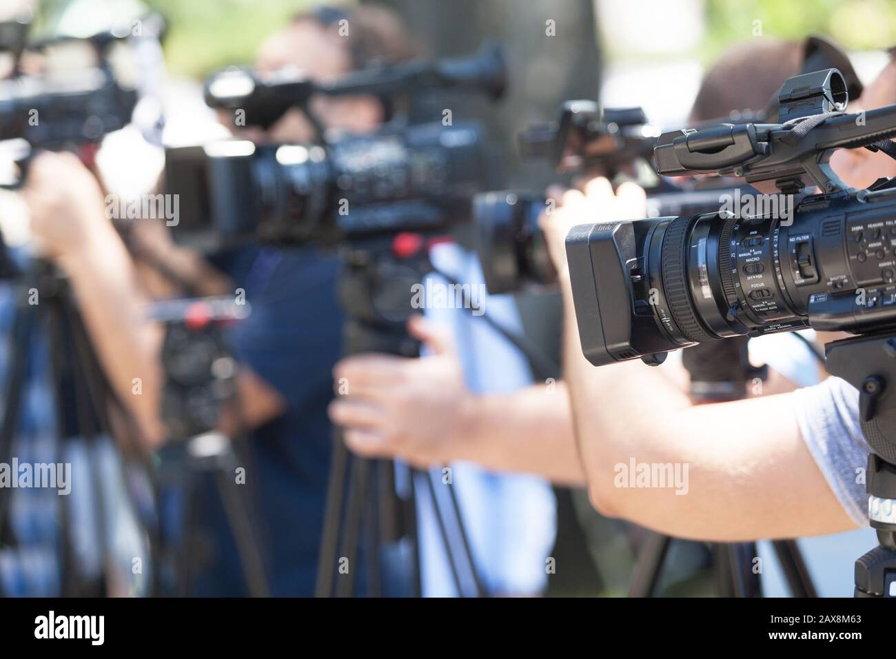 Press conference. Filming news event with a video camera Stock Photo ...