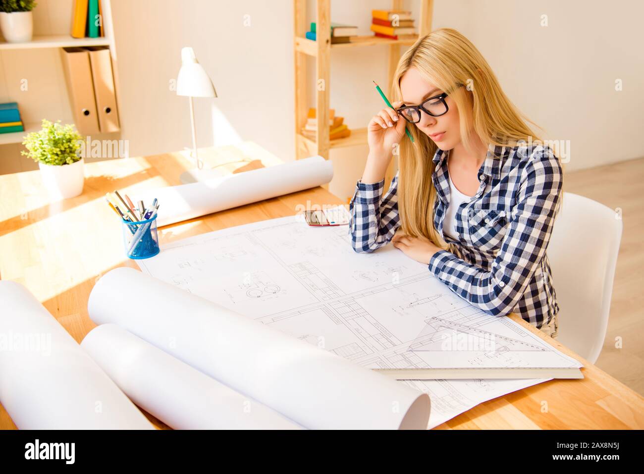 Pretty smart woman drawing scheme for her project Stock Photo - Alamy
