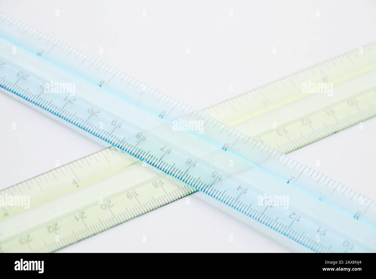 colorful plastic ruler crossing on white background Stock Photo - Alamy