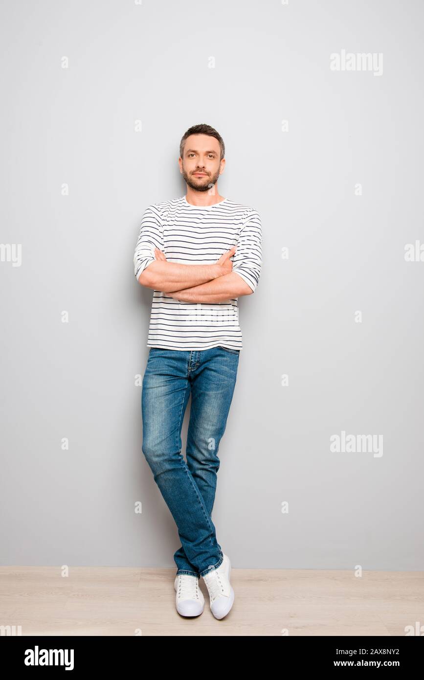 Full length portrait of happy stylish man with crossed hands Stock ...