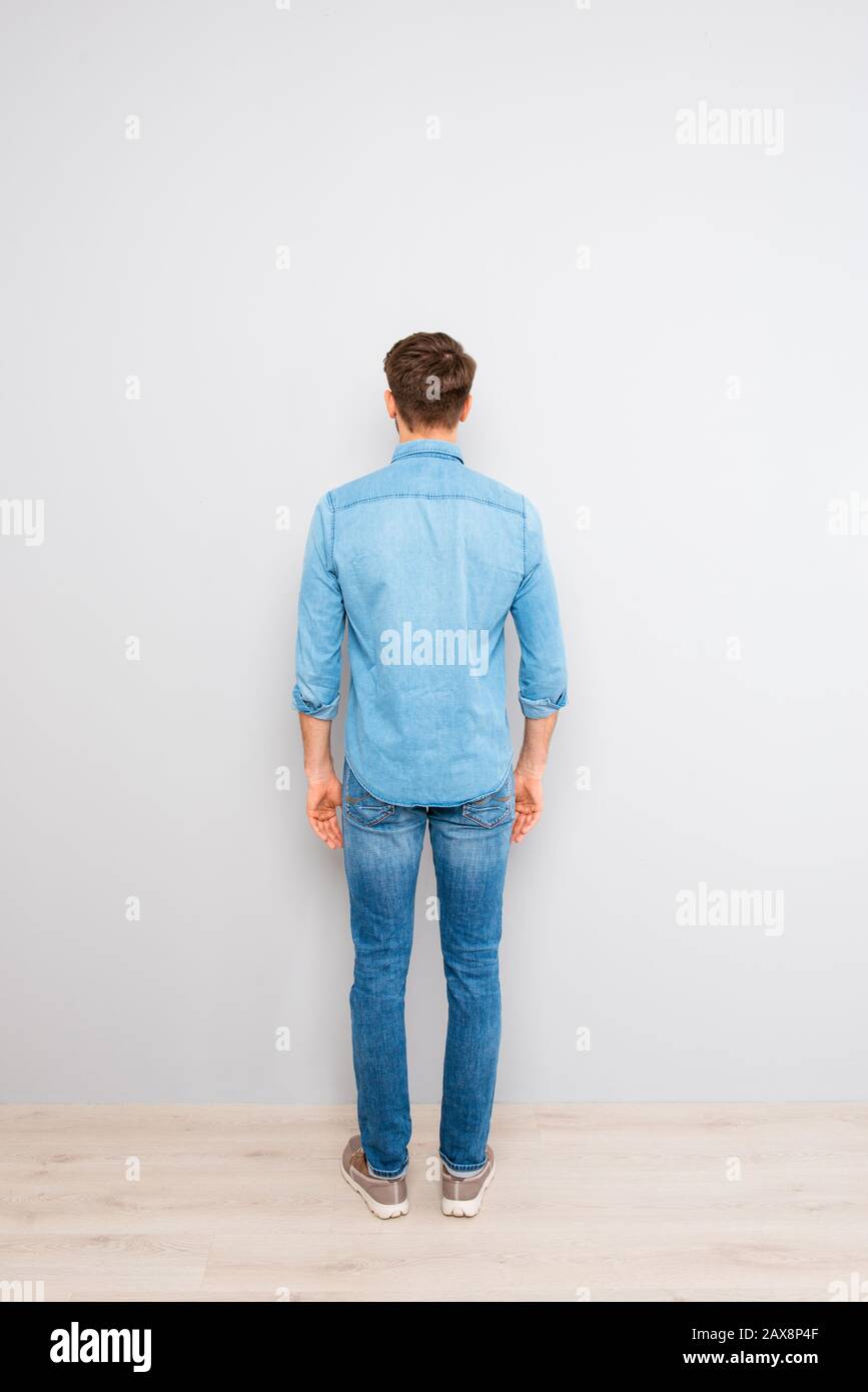 Full back view photo of young man on gray background Stock Photo - Alamy