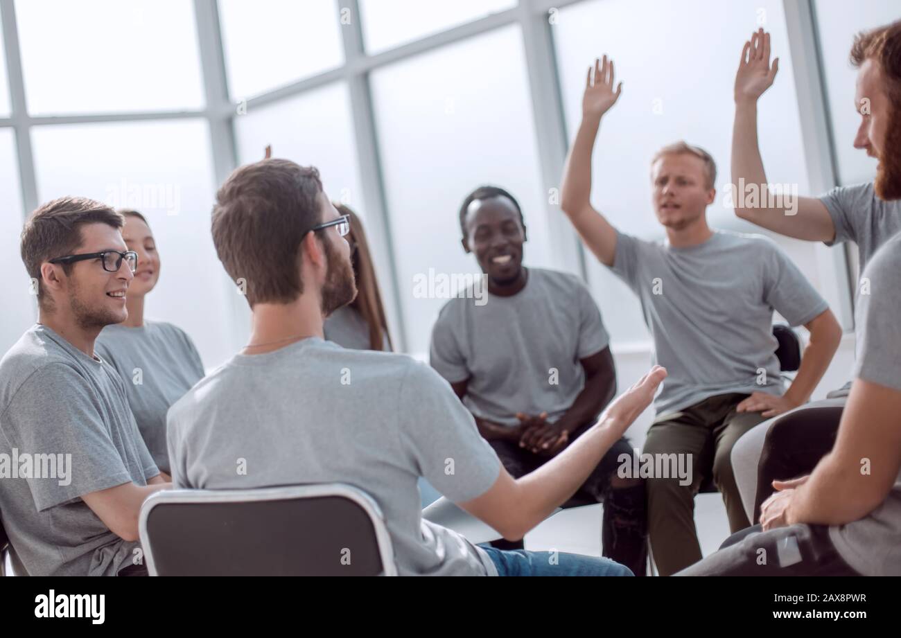 young people ask questions during the meeting Stock Photo - Alamy