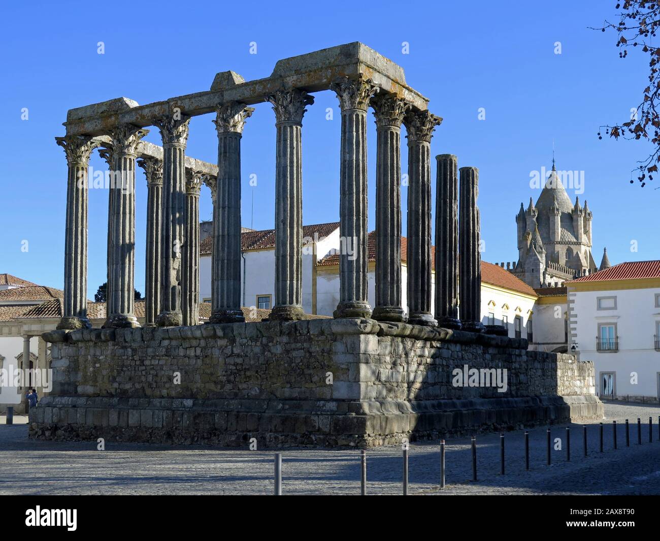 Roman Temple of Évora. In the background the Gothic Cathedral Tower ...