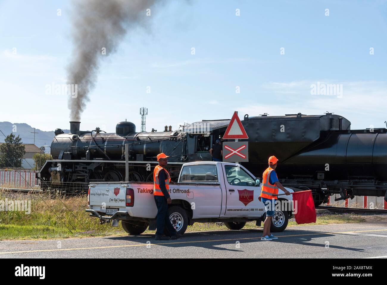 Wolseley, Swartland region, South Africa. 2019. Man with red flag holds ...