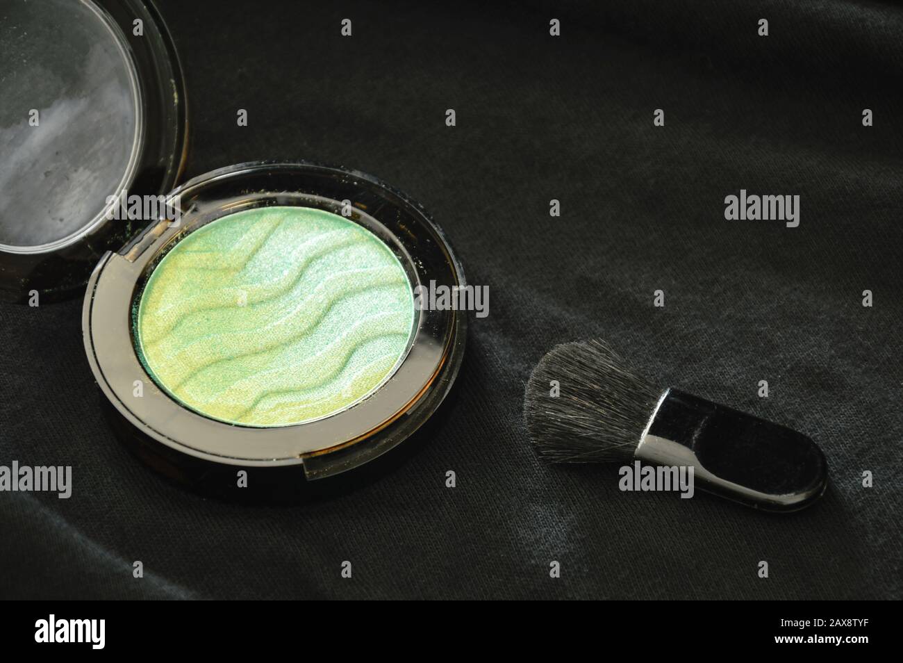 blusher powder cartridges and blush on black fabric background Stock ...