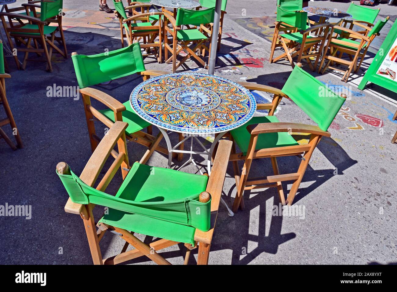 Matala, Greece - October 07, 2018: Colorful chairs and table in a ...