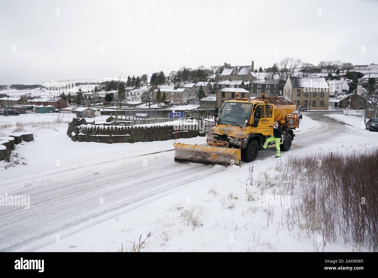 A snow plow clears a road in Nenthead, Cumbria Stock Photo - Alamy