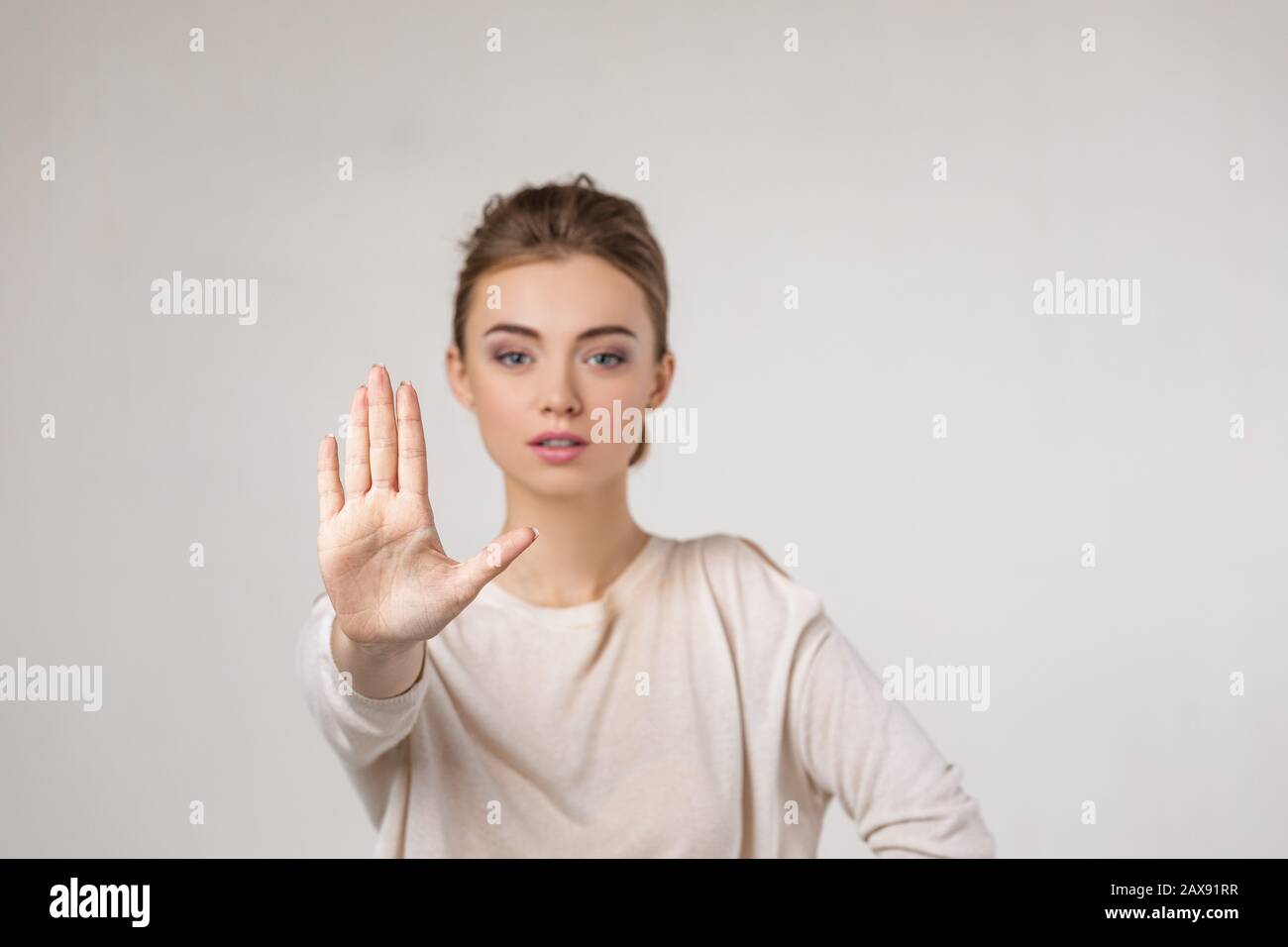 beautiful young woman making stop gesture on gray background Stock ...