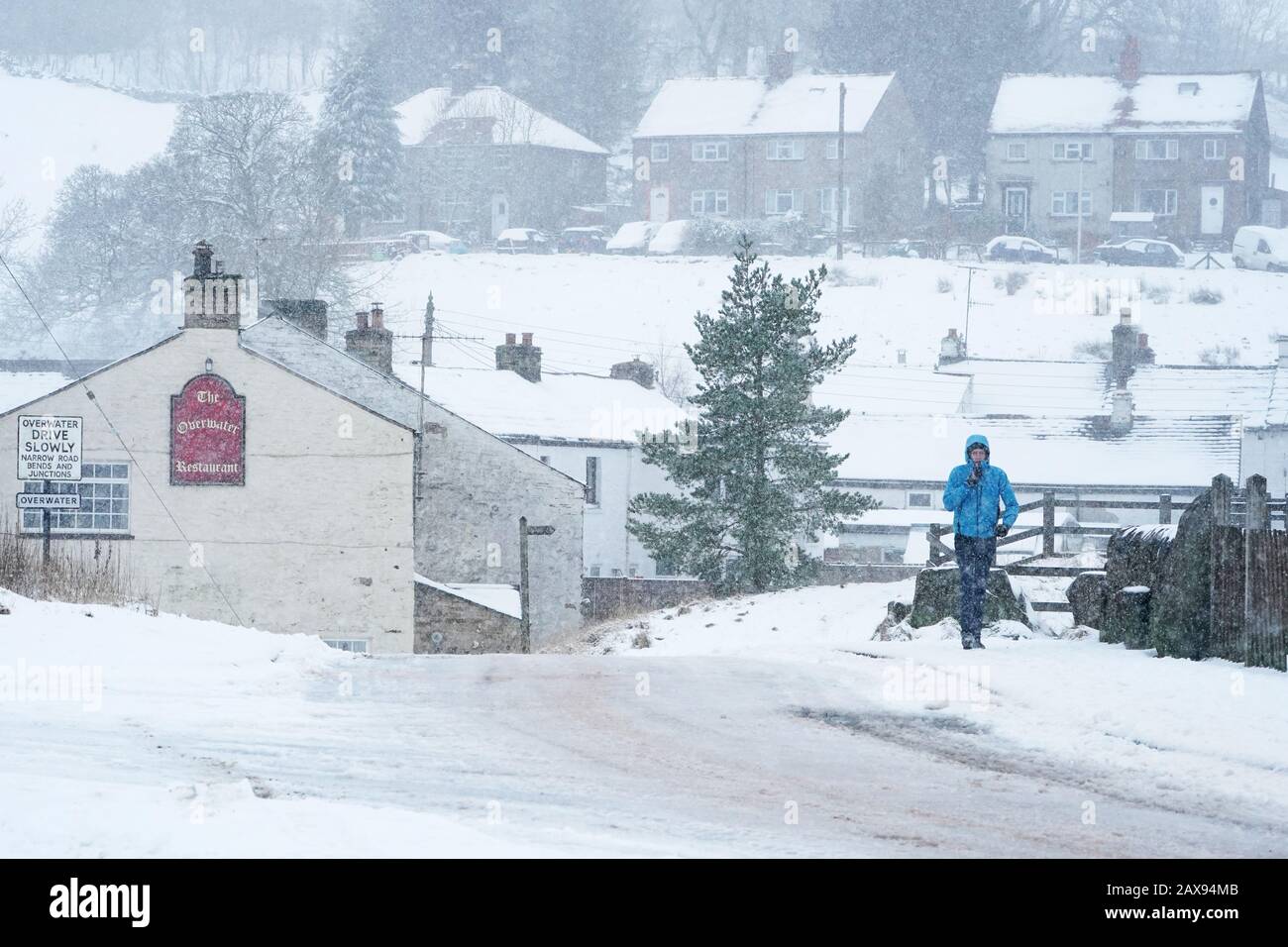 A man walks through the snow in Nenthead, Cumbria Stock Photo - Alamy