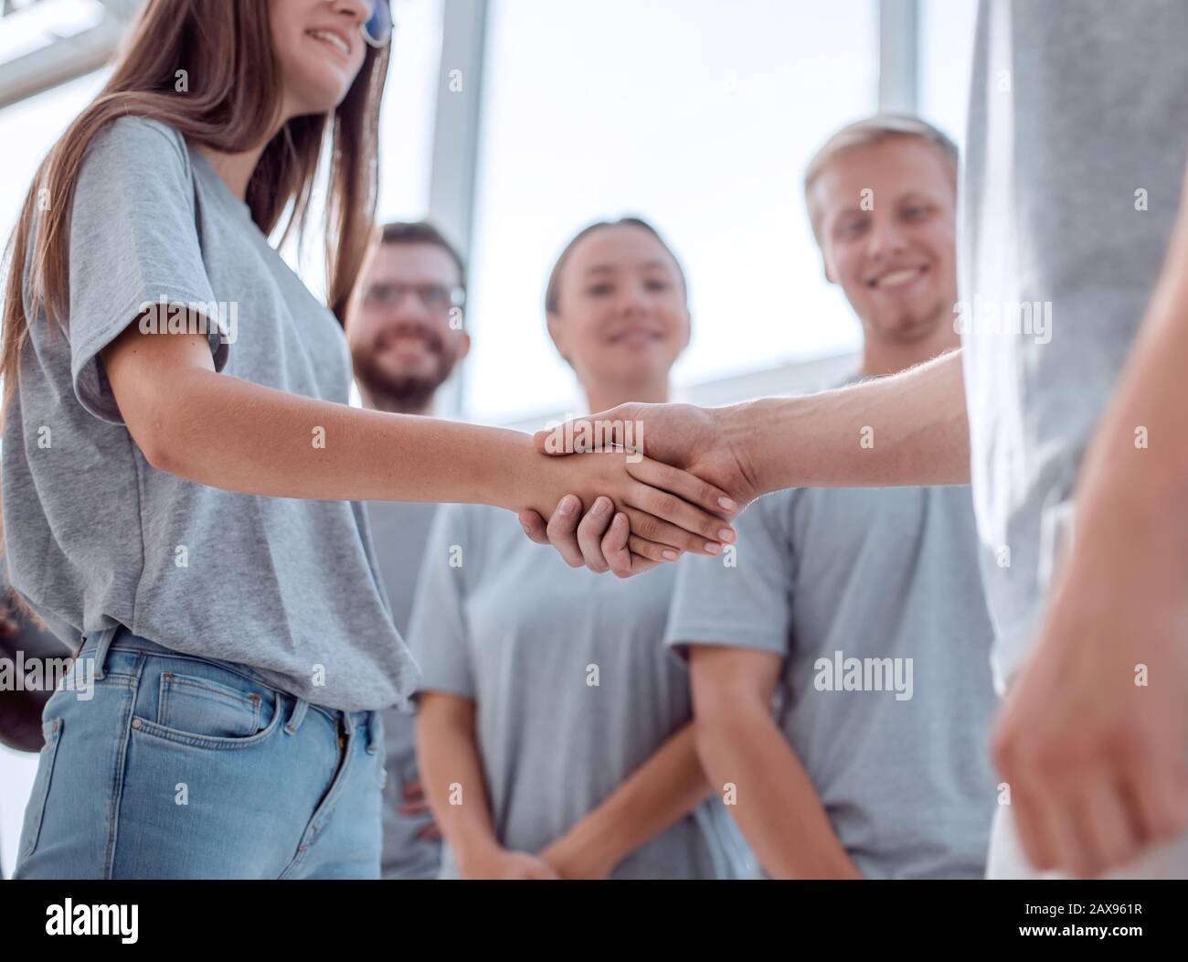 young leaders greet each other with a handshake Stock Photo - Alamy