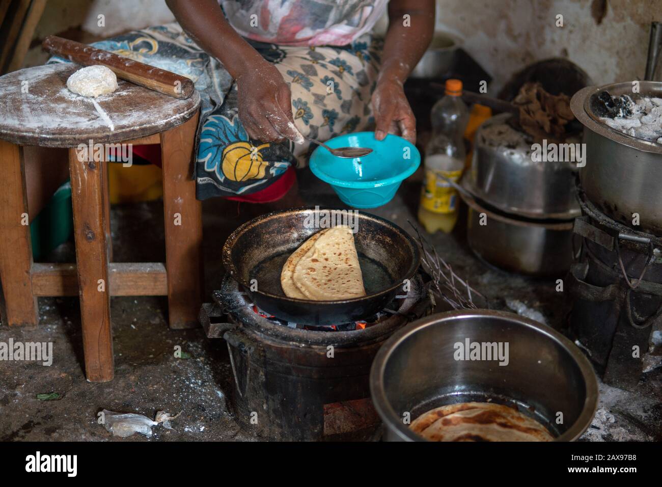Basic African kitchen. Cooking on the fire Chapati - local food Stock ...