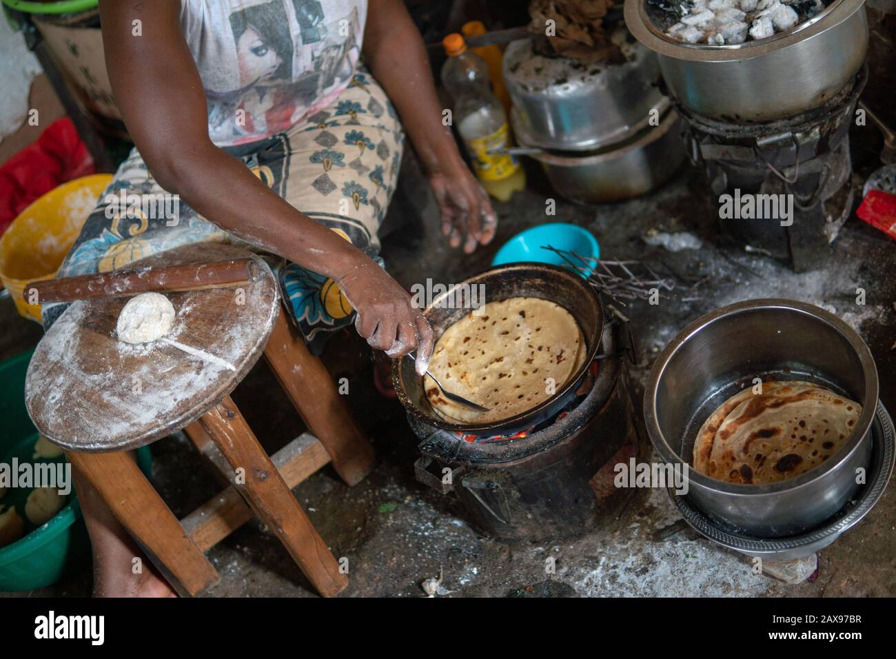 Basic African kitchen. Cooking on the fire Chapati - local food Stock ...