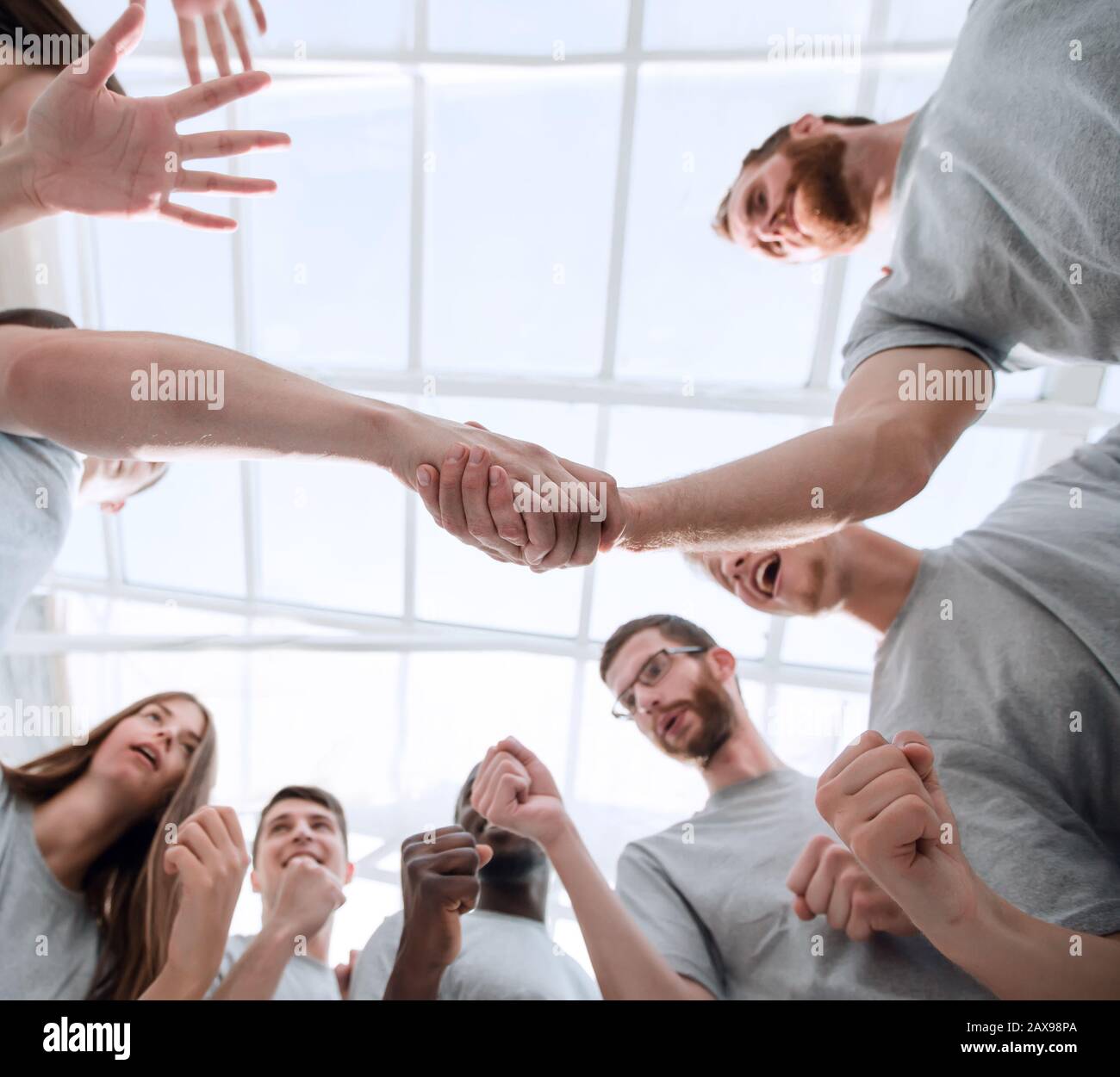 strong handshake of the two leaders in the circle of friends Stock ...