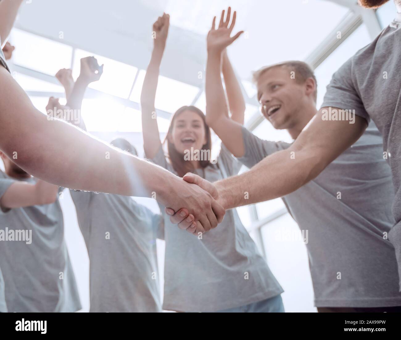 young people congratulating each other on the victory Stock Photo - Alamy