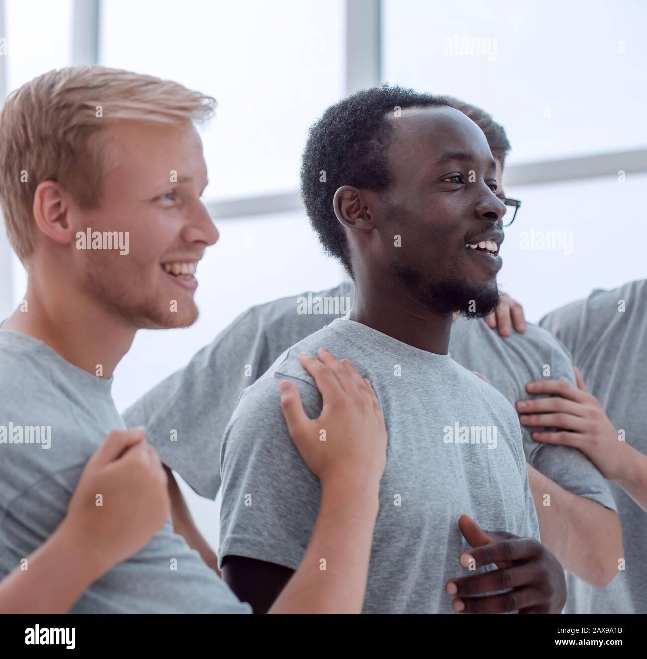 close up. cheering team welcoming their leader Stock Photo - Alamy