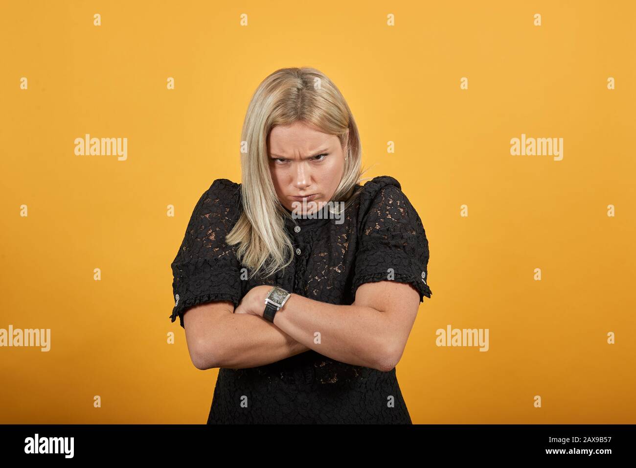 Young offended angry woman folded her arms, being angry on her ...