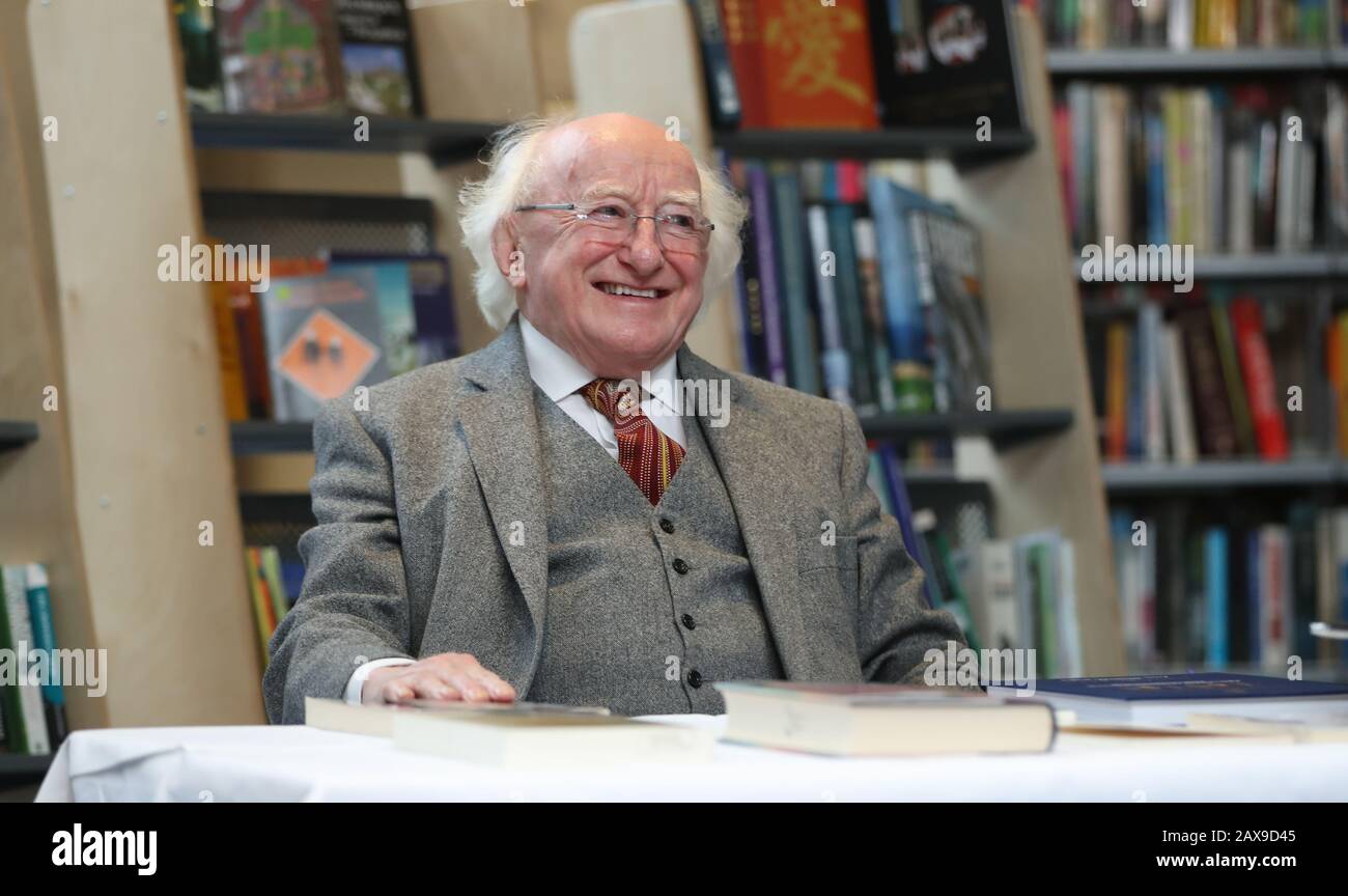 President Michael D Higgins signs some of his own books at Cabra ...