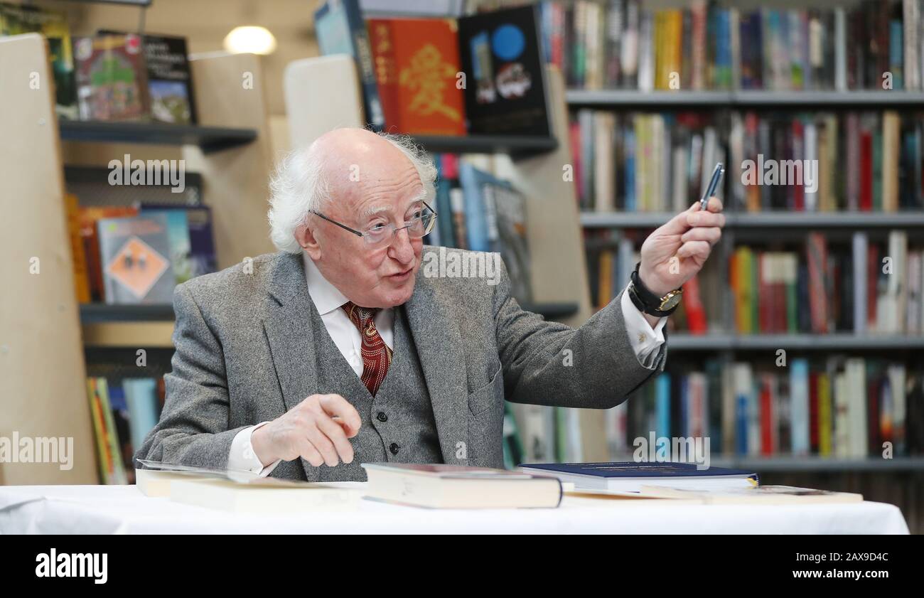President Michael D Higgins signs some of his own books at Cabra ...