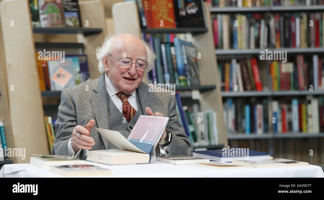 President Michael D Higgins signs some of his own books at Cabra ...