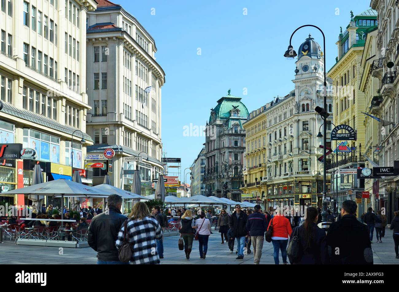 Vienna, Austria - March 27th 2016: Crowd of unidentified people, shops ...