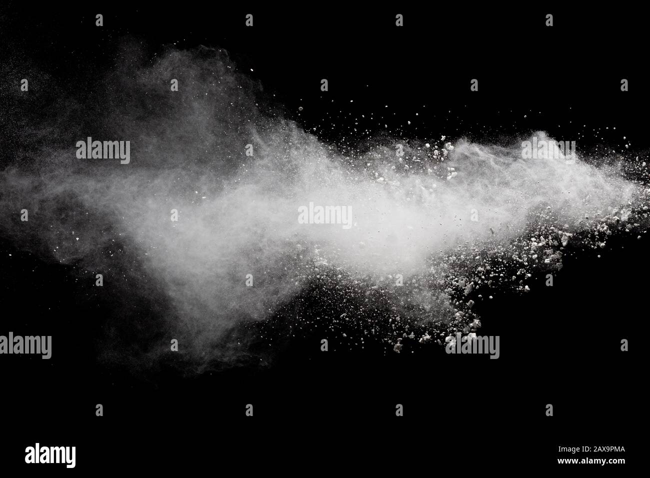 Abstract white powder explosion.White dust debris on black background ...