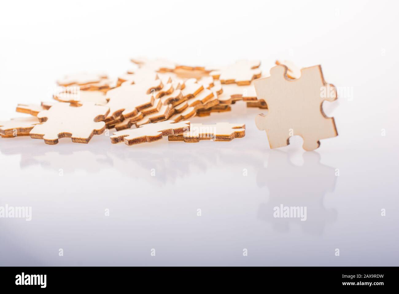 Pieces of jigsaw puzzle as problem solution concept on white background ...