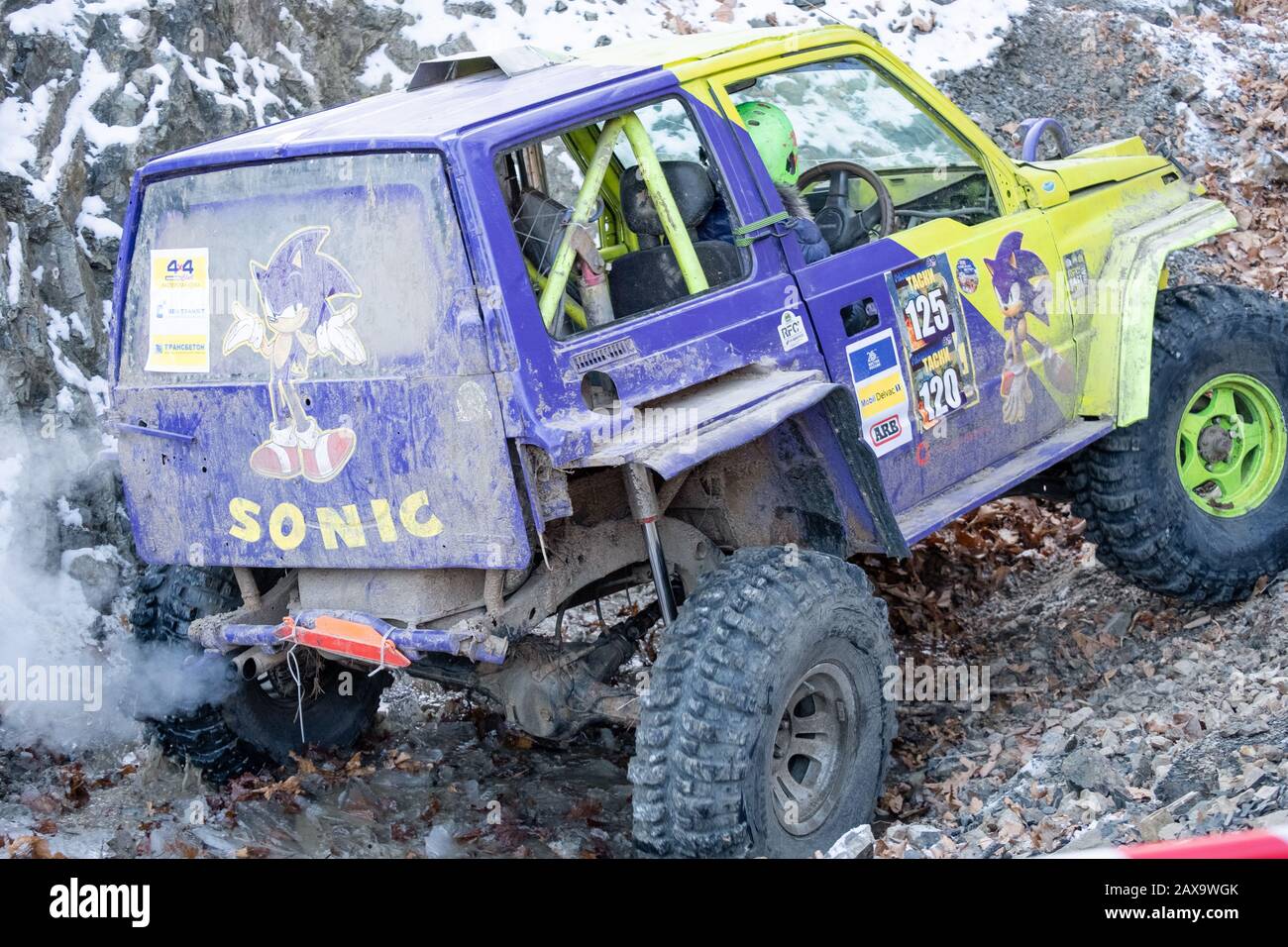 Jeep Suzuki Jimny overcomes obstacles in the forest Stock Photo - Alamy
