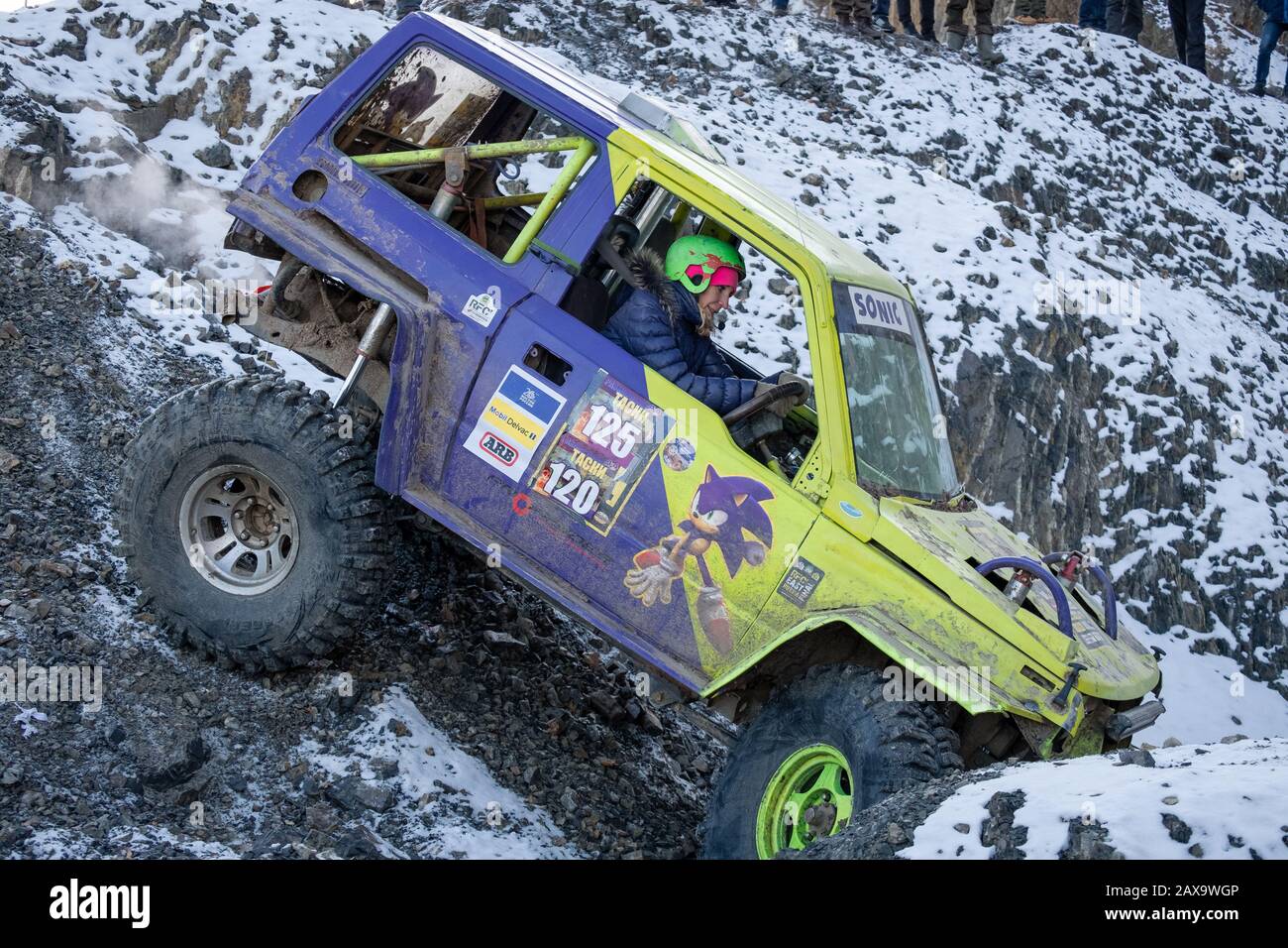 Jeep Suzuki Jimny overcomes obstacles in the forest Stock Photo - Alamy