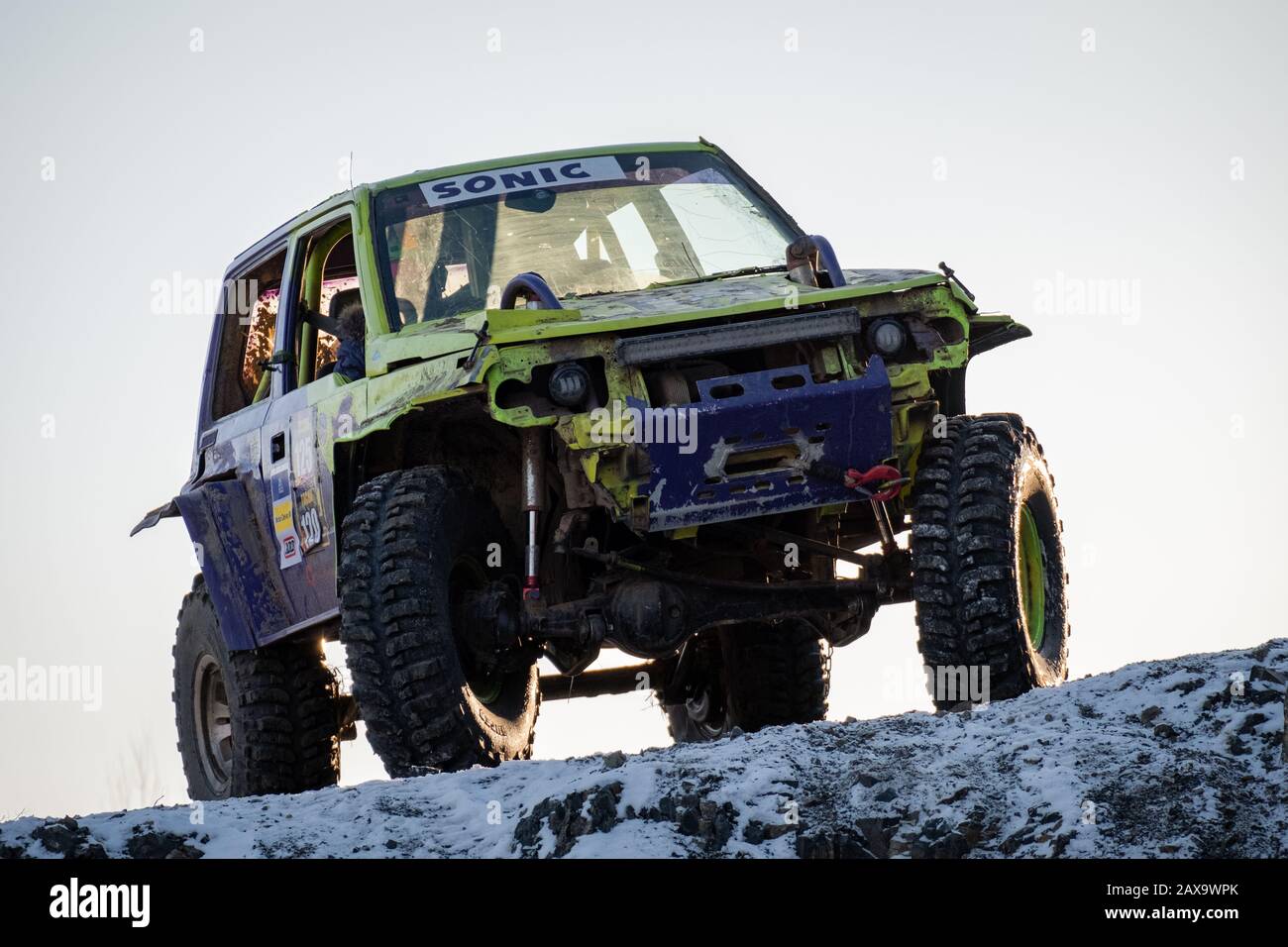 Jeep Suzuki Jimny overcomes obstacles in the forest Stock Photo - Alamy