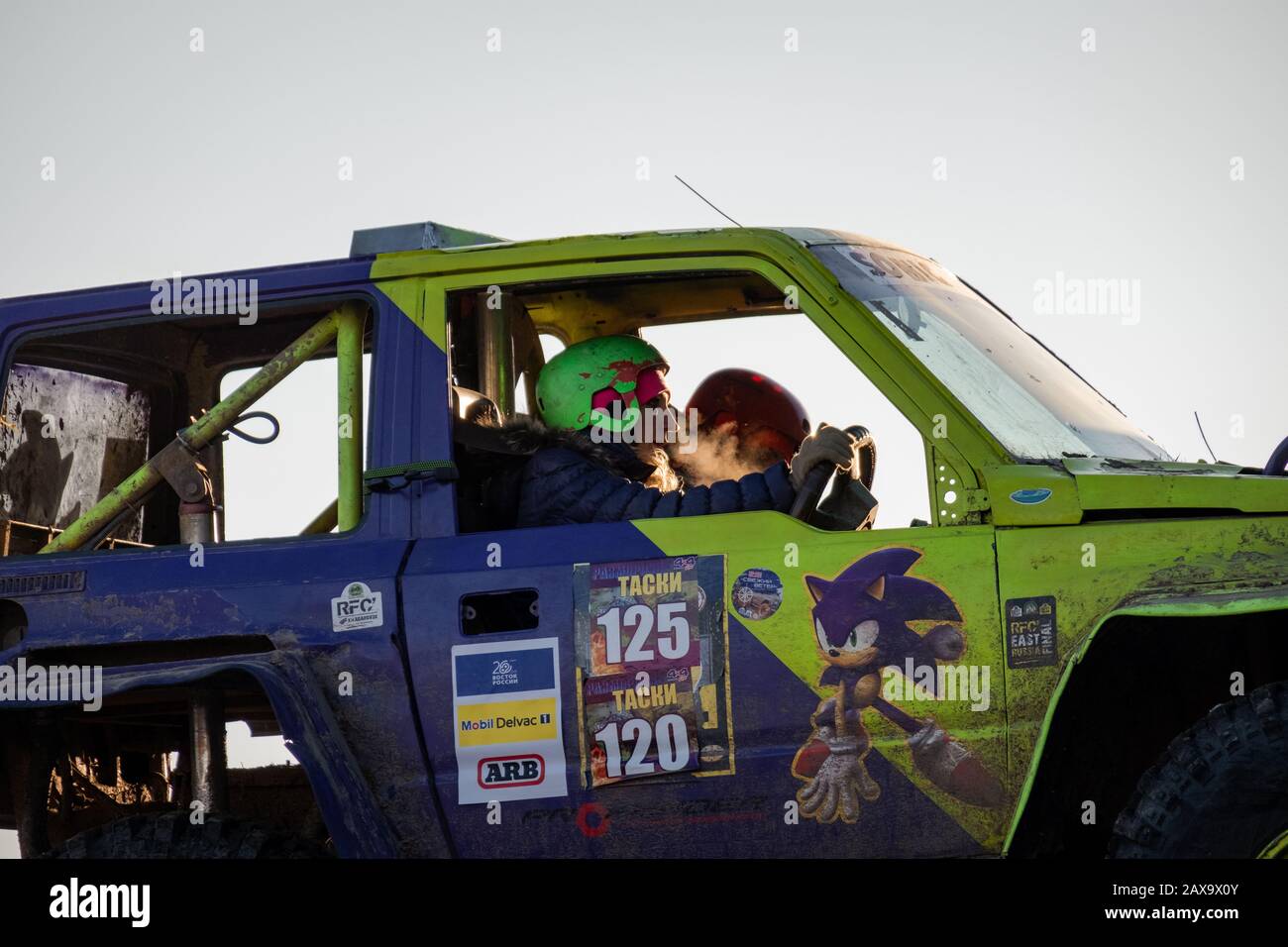 Jeep Suzuki Jimny overcomes obstacles in the forest Stock Photo - Alamy