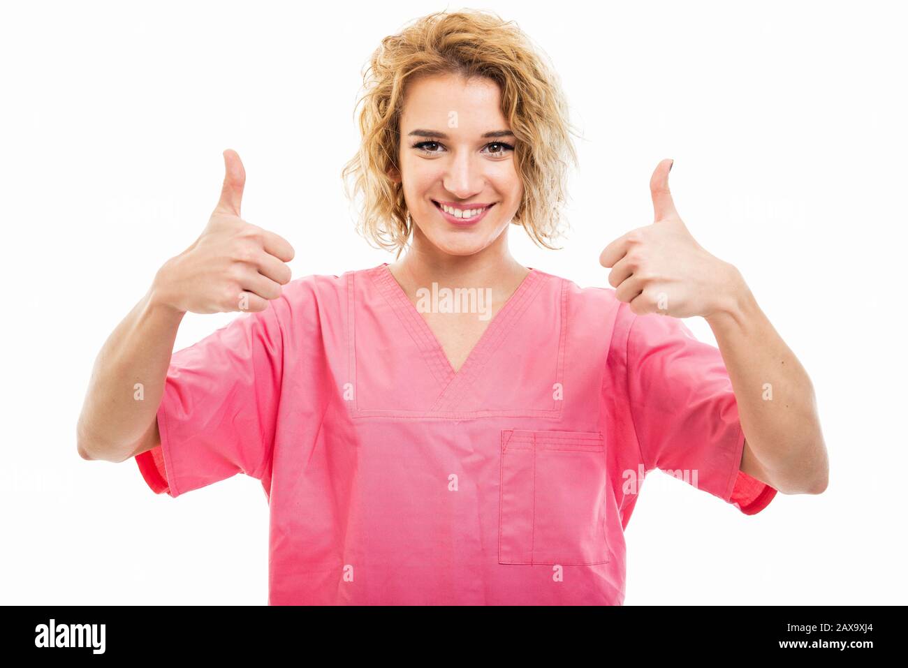 Portrait Of Young Nurse Wearing Pink Scrub Showing Double Like Gesture
