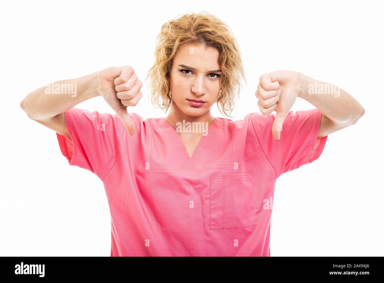 Portrait Of Young Nurse Wearing Pink Scrub Showing Double Dislike