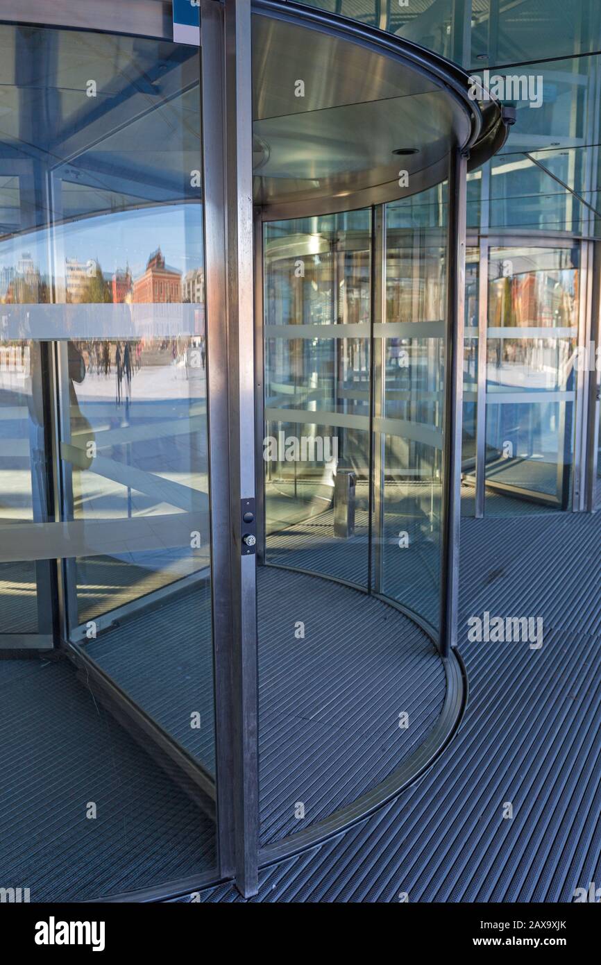 Automatic Revolving Doors at Modern Building Entrance Stock Photo - Alamy
