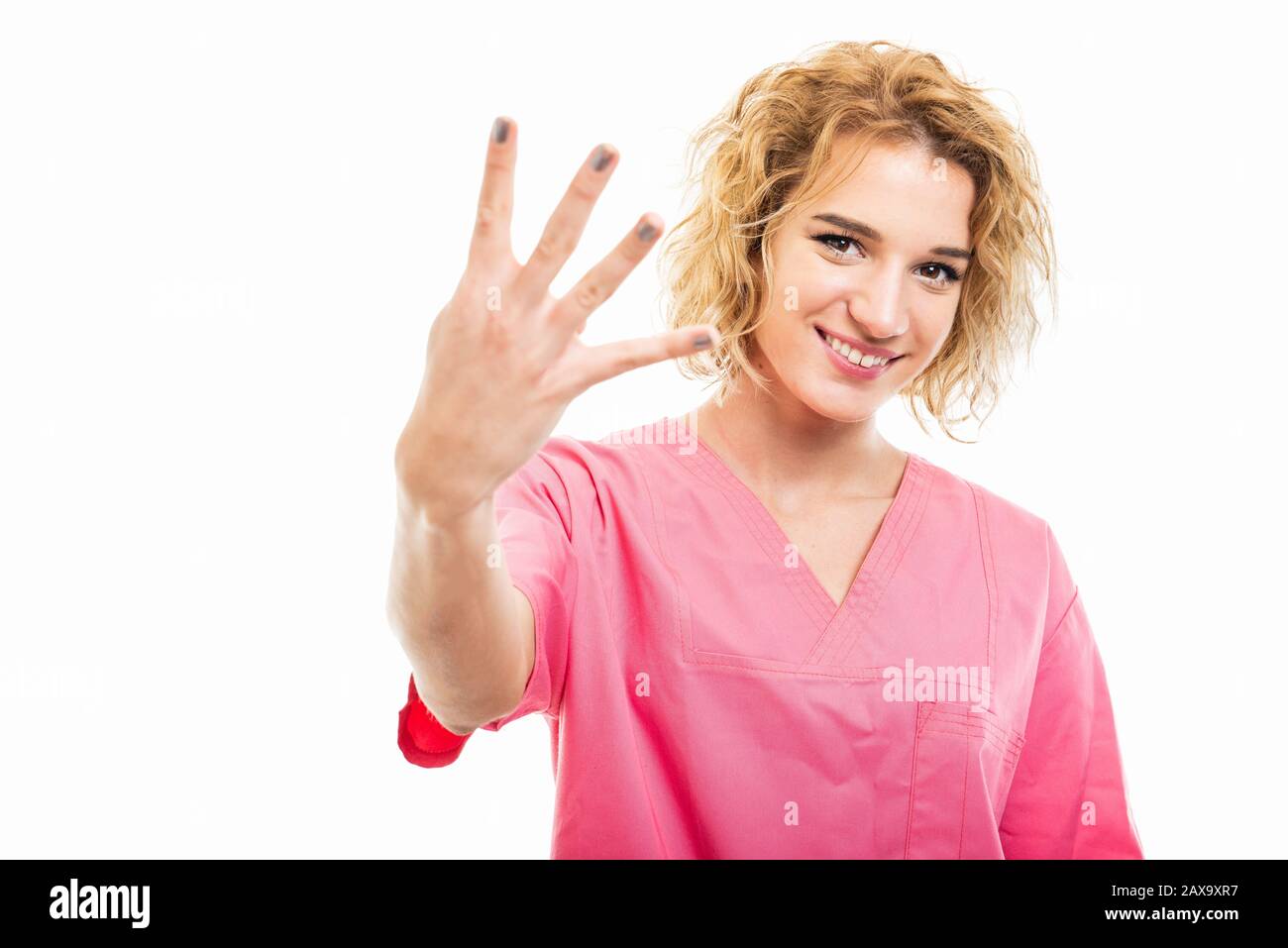 Portrait Of Nurse Wearing Pink Scrub Showing Number Four Isolated On