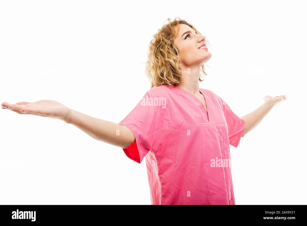 Portrait of nurse wearing pink with arms spread like winning isolated ...