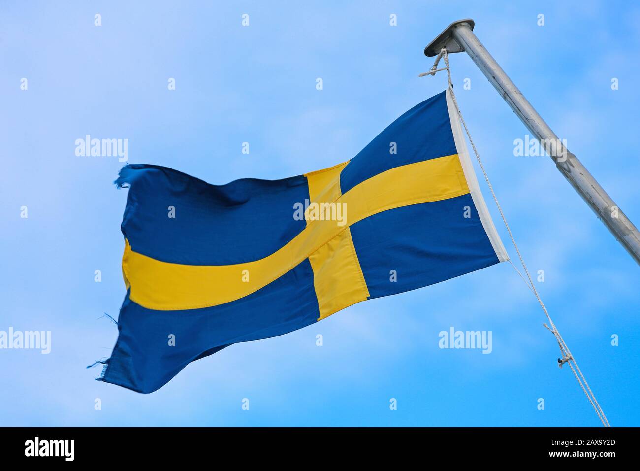 Swedish Flag Yellow Cross Over Blue at Sky Stock Photo - Alamy