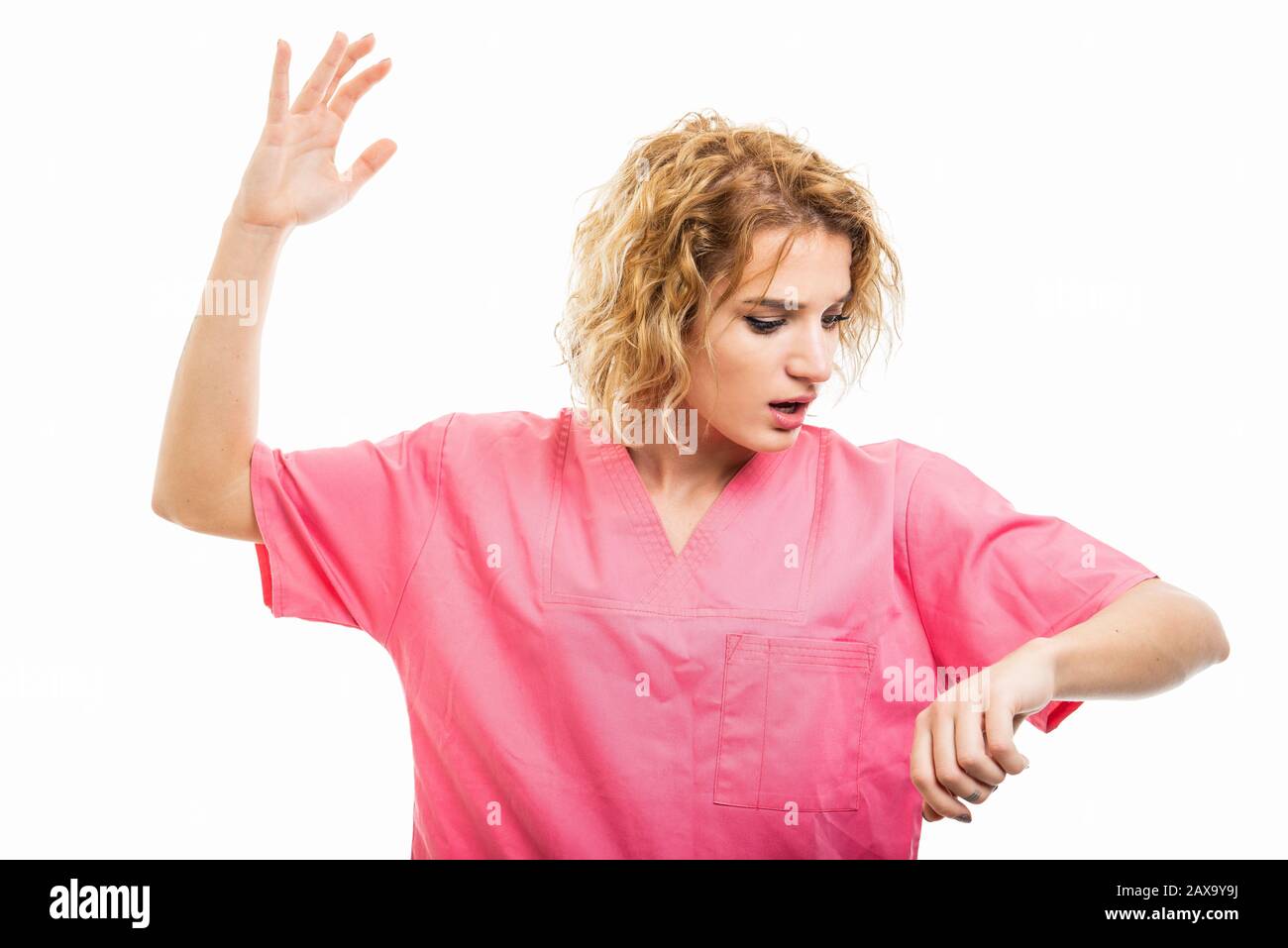 Portrait Of Nurse Wearing Pink Scrubs Making Late Gesture Isolated On