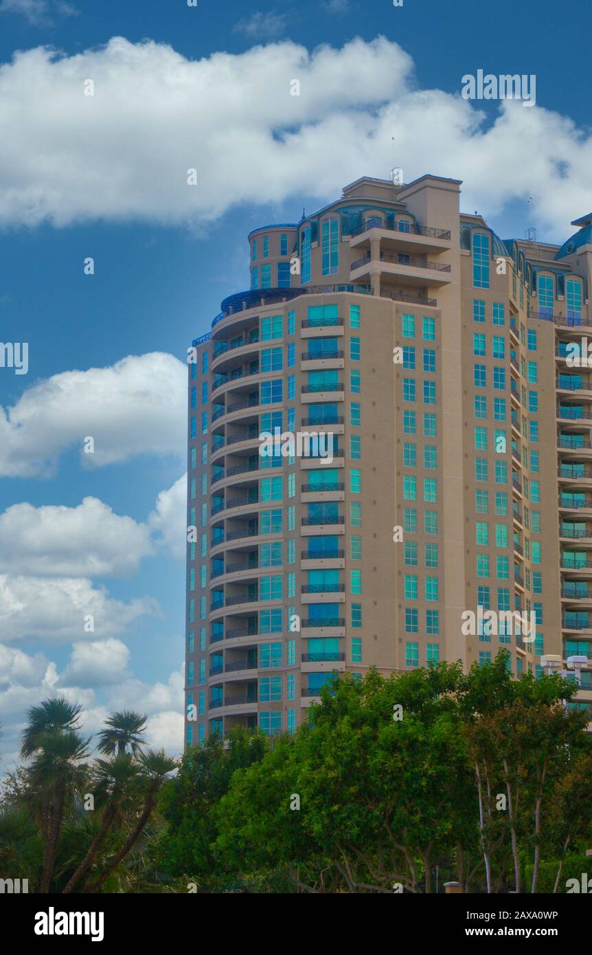 Modern Condo Tower Rising From Trees Stock Photo - Alamy