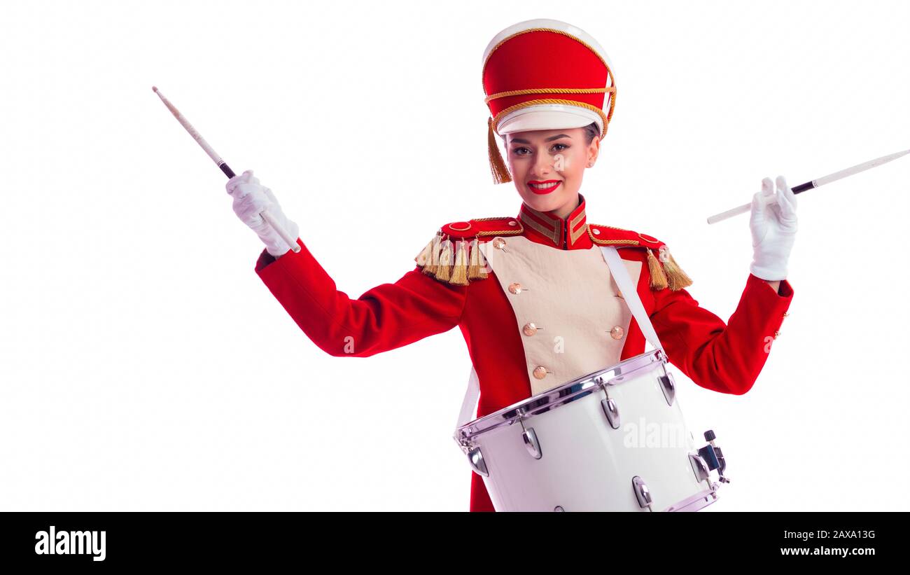 Drummer in a red uniform drums on a drum, show program and celebration ...