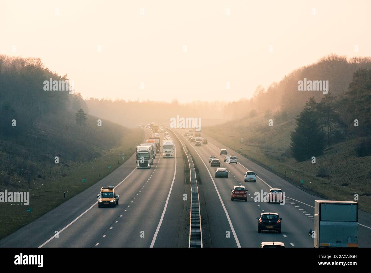 California highway with air pollution and smog with the sunset light ...