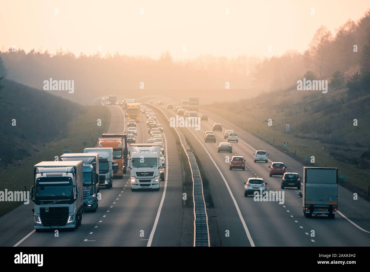 California highway with air pollution and smog with the sunset light ...