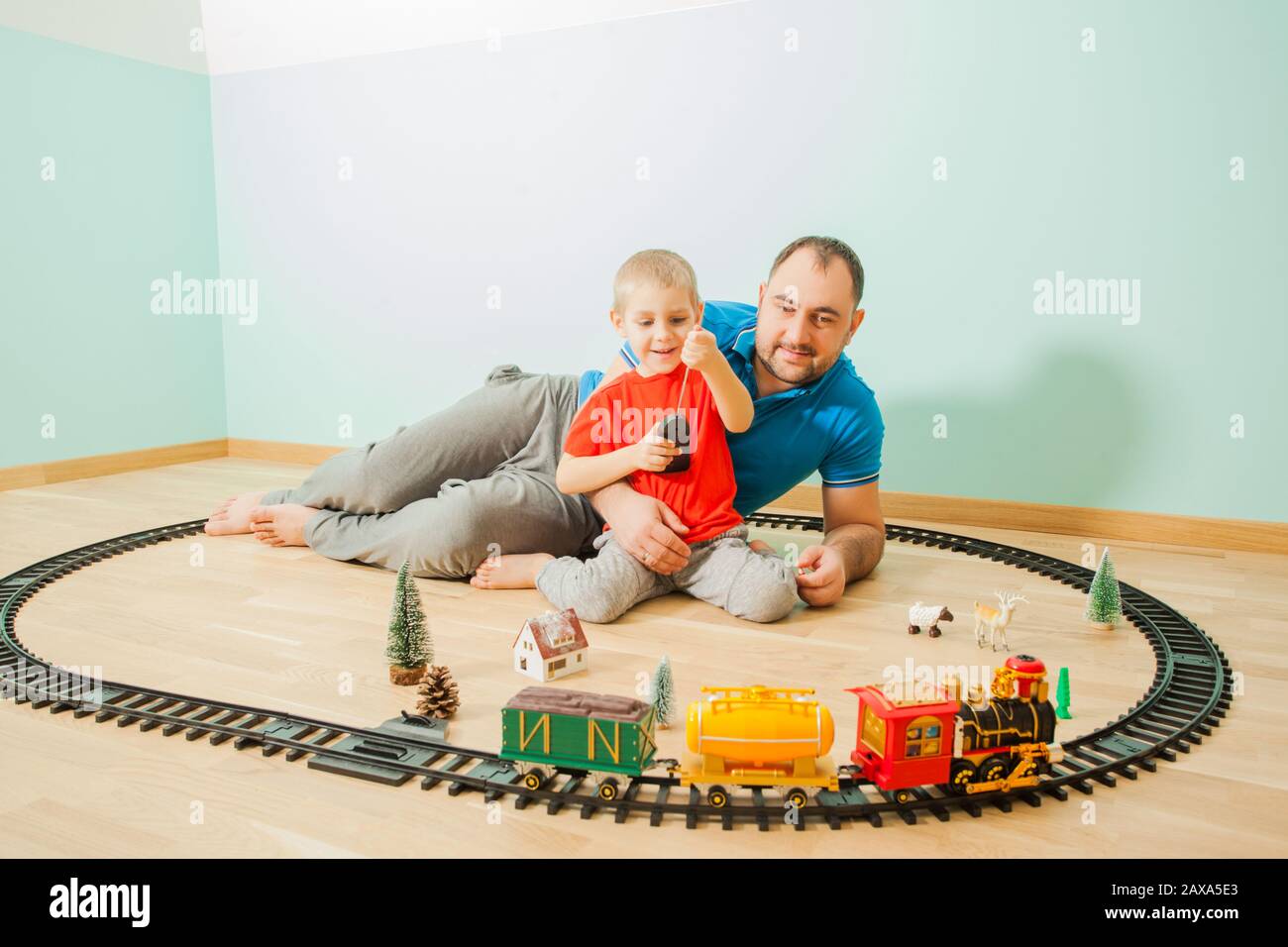 Happy child playing train father hi-res stock photography and images ...