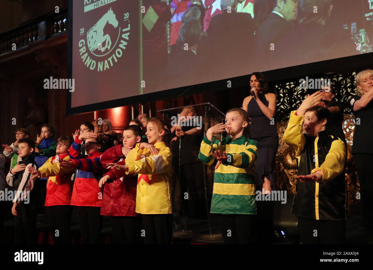 The Liverpool Signing Choir perform during the Grand National weights ...