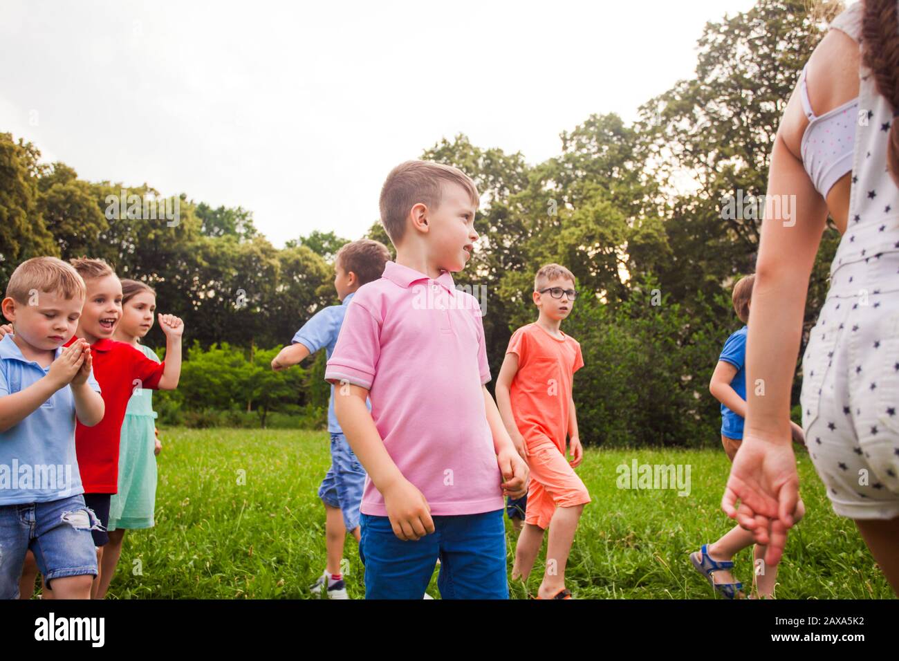 Happy children playing outdoors games in a park Stock Photo - Alamy
