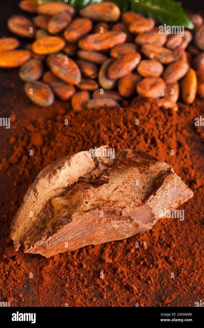 Cocoa beans, chocolate block and cocoa powder close up Stock Photo - Alamy